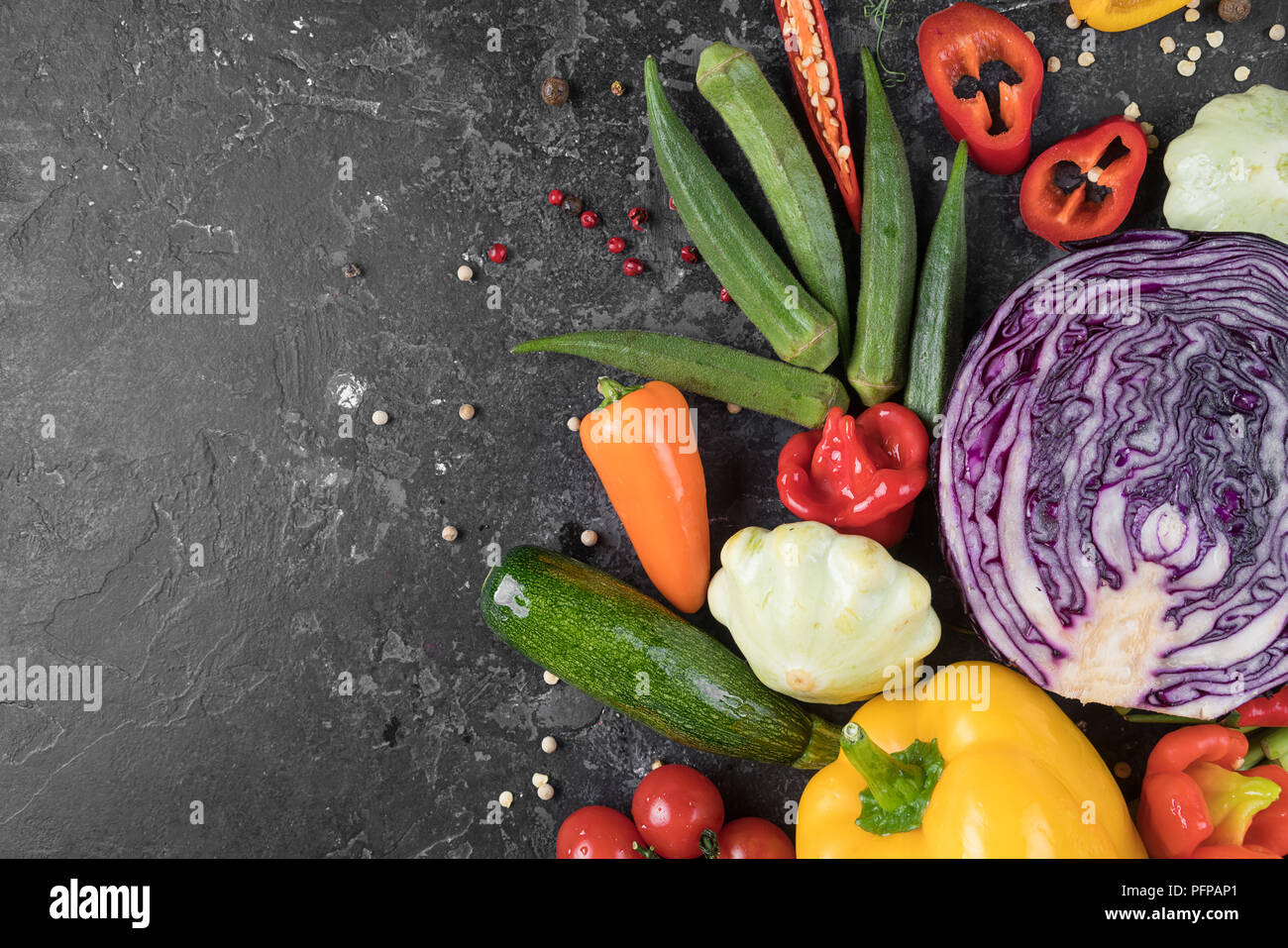 Food background. Fresh farmer vegetables at dark beton table. Space for ...