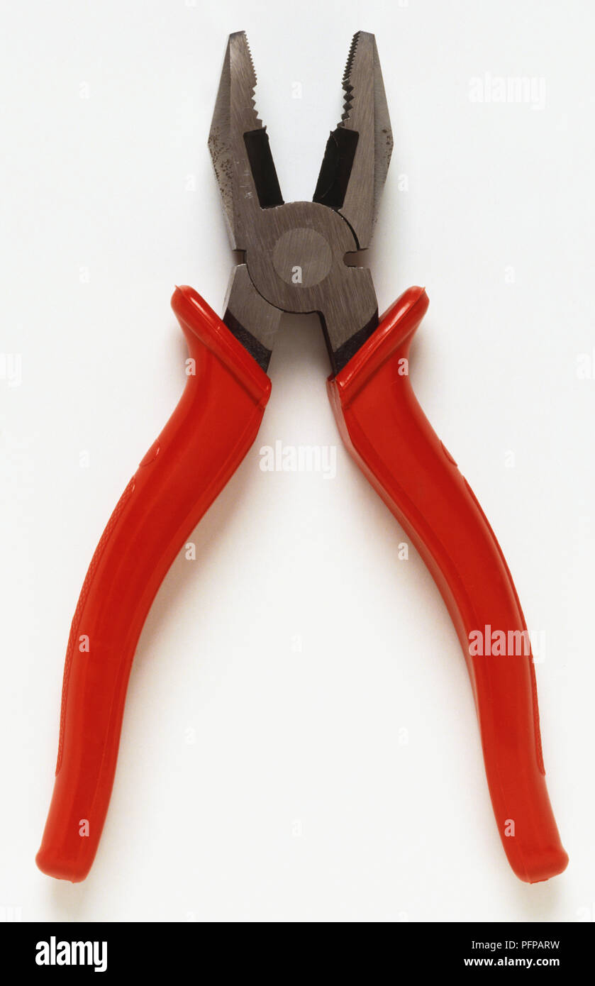 Pliers with red handles Stock Photo - Alamy