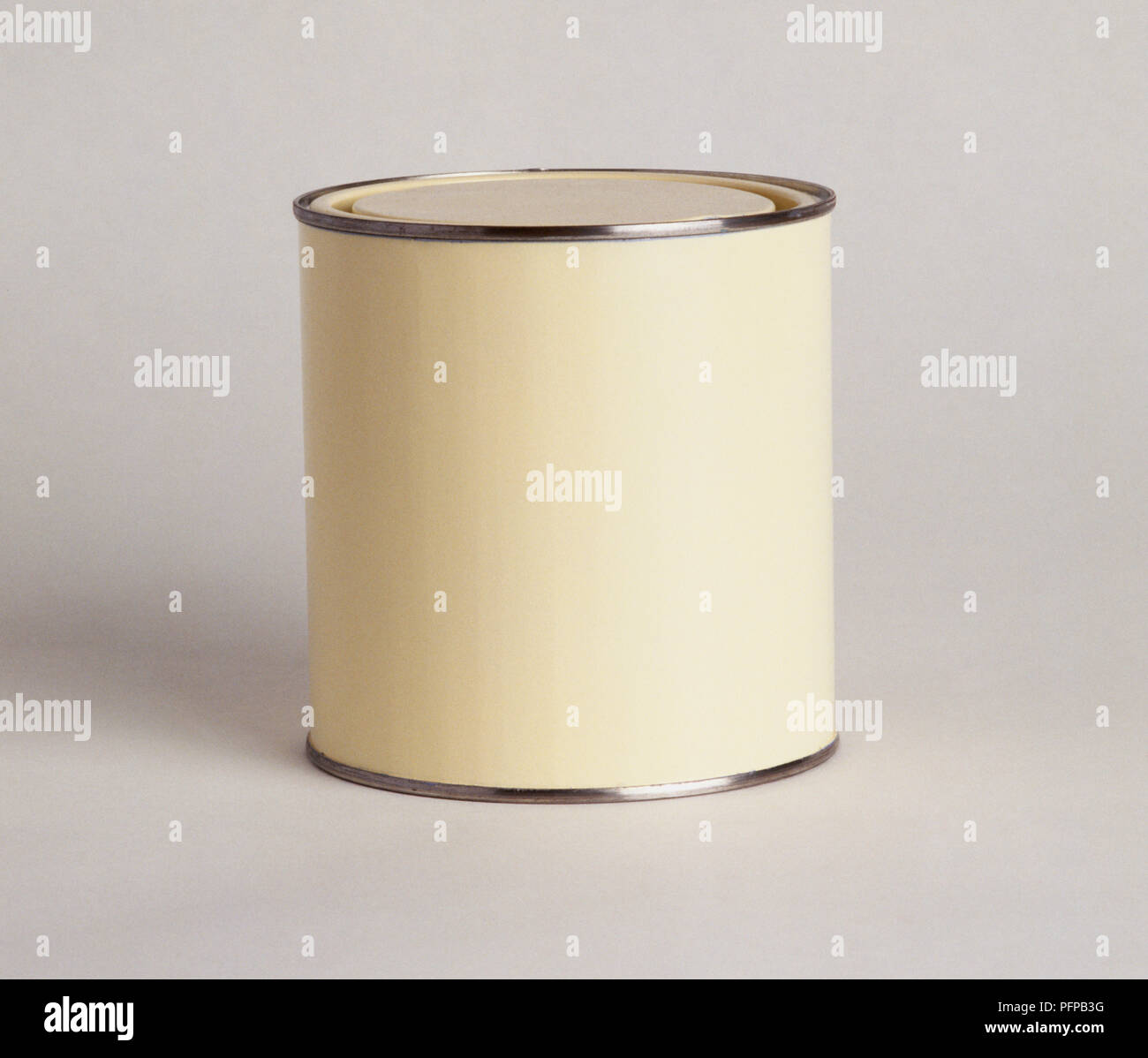 Tin of paint, unlabelled, front view Stock Photo - Alamy