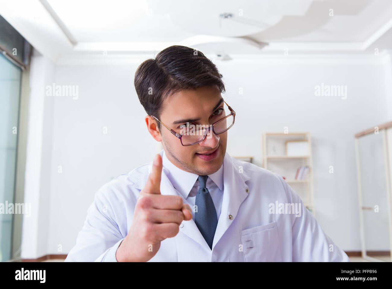 Angry pointing doctor young man hi-res stock photography and images - Alamy