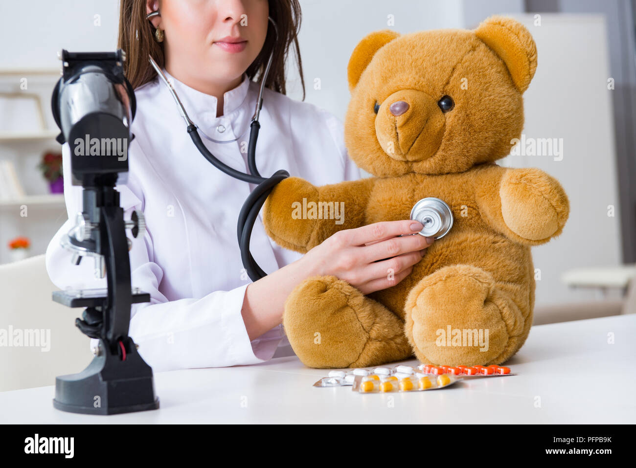 Child checking soft toy health Stock Photo - Alamy