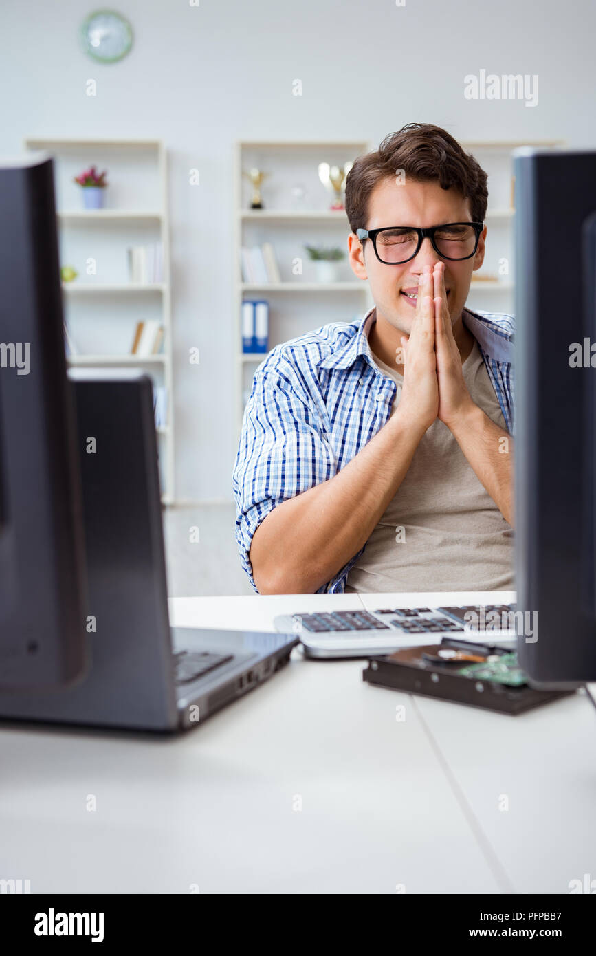 Young trader monitoring markets on screens Stock Photo - Alamy