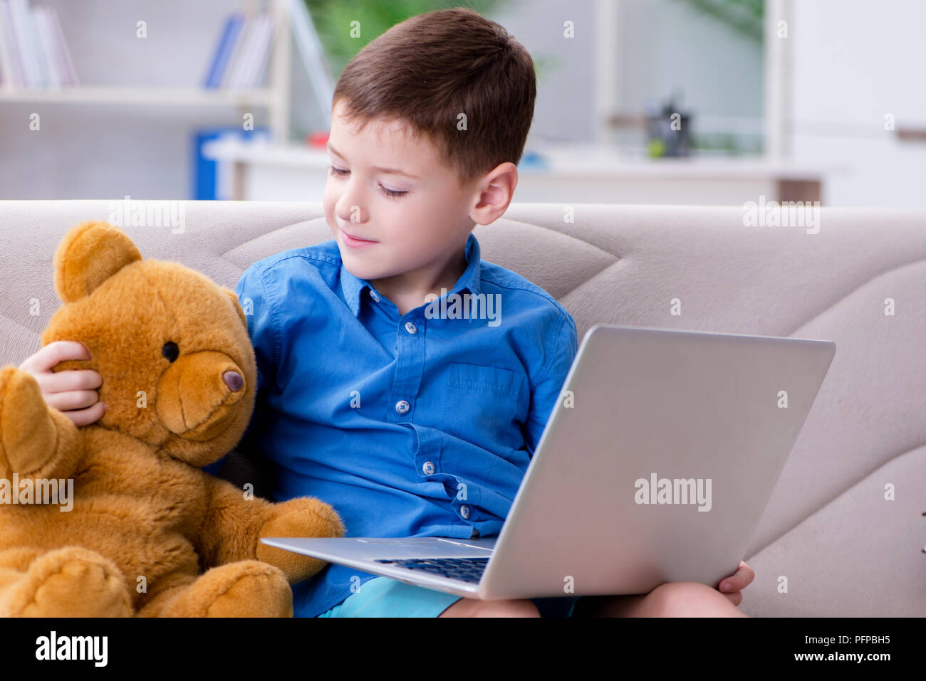 Little boy surfing internet on laptop Stock Photo - Alamy