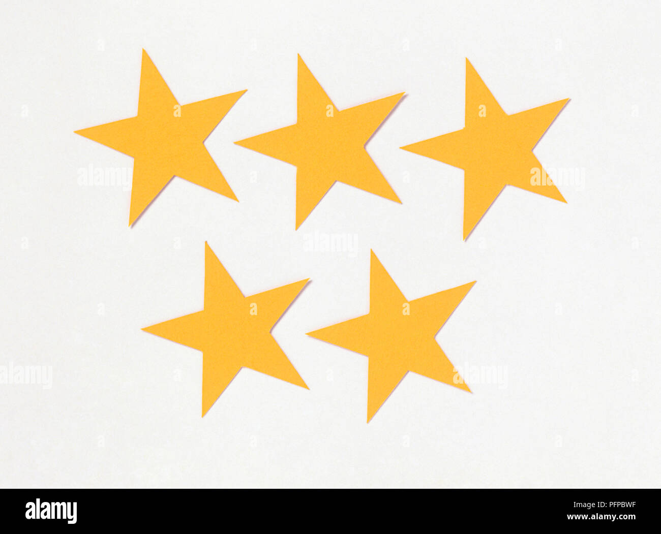Six yellow paper stars Stock Photo - Alamy