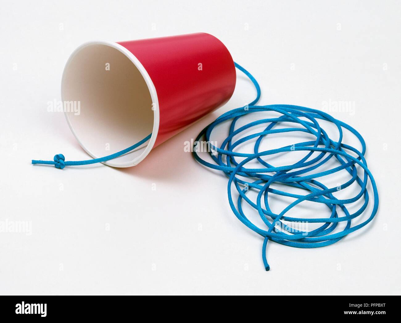 Paper cup with through the bottom Stock Photo - Alamy