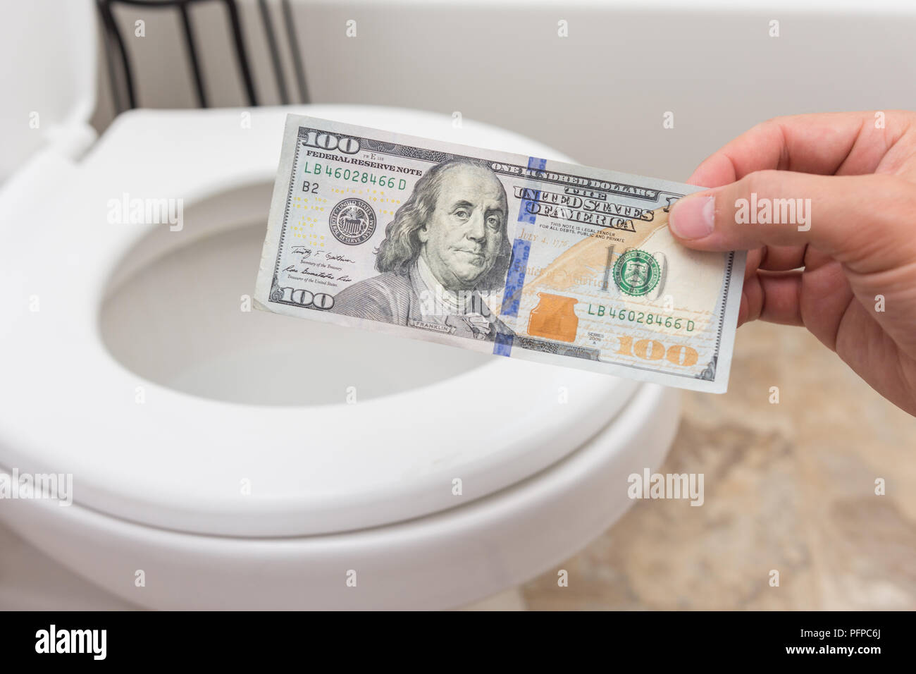 Flush money toilet hi-res stock photography and images - Alamy