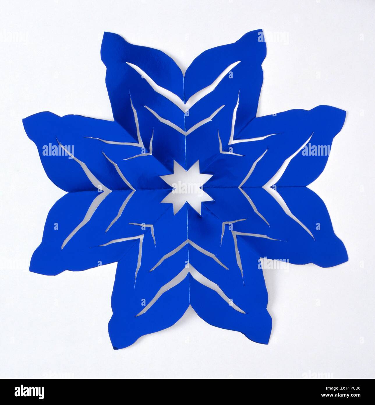Blue paper snowflake Stock Photo - Alamy
