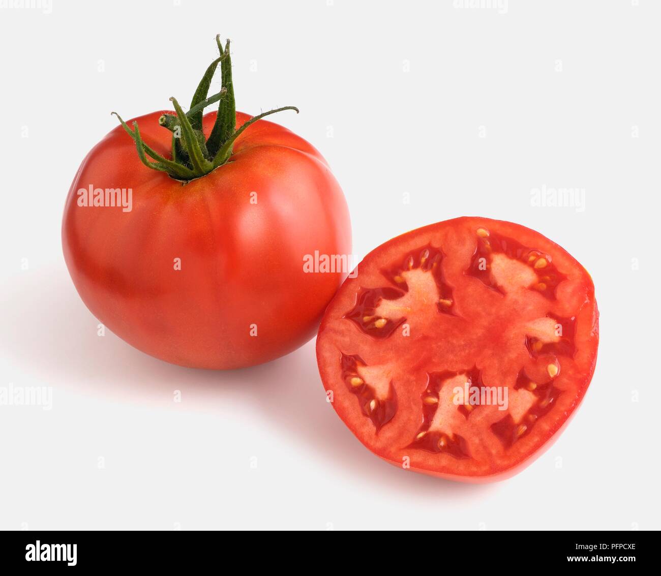 Whole and sliced Dutch hybrid beefsteak Country Taste tomatoes Stock ...