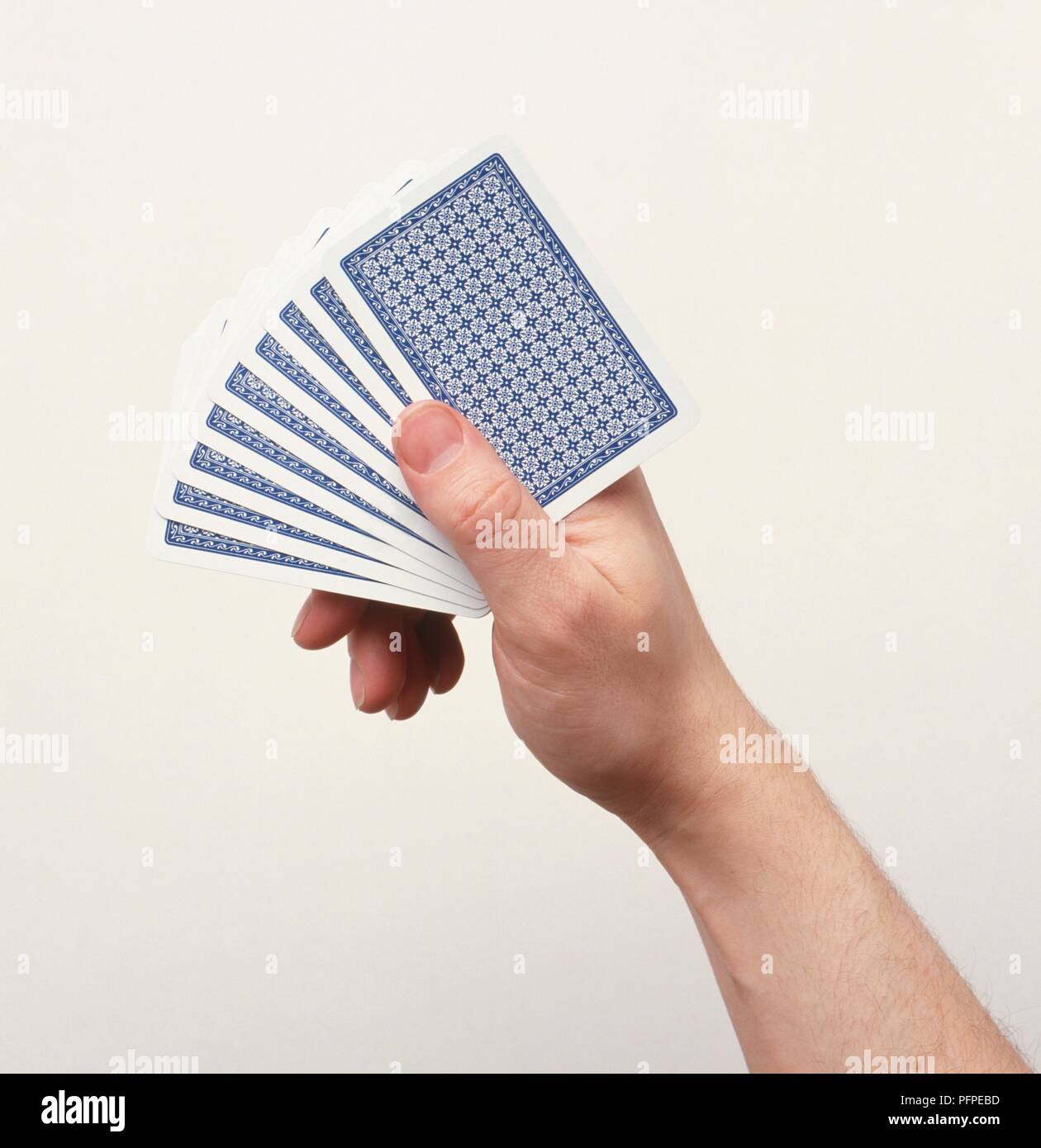 Holding deck of cards hi-res stock photography and images - Alamy