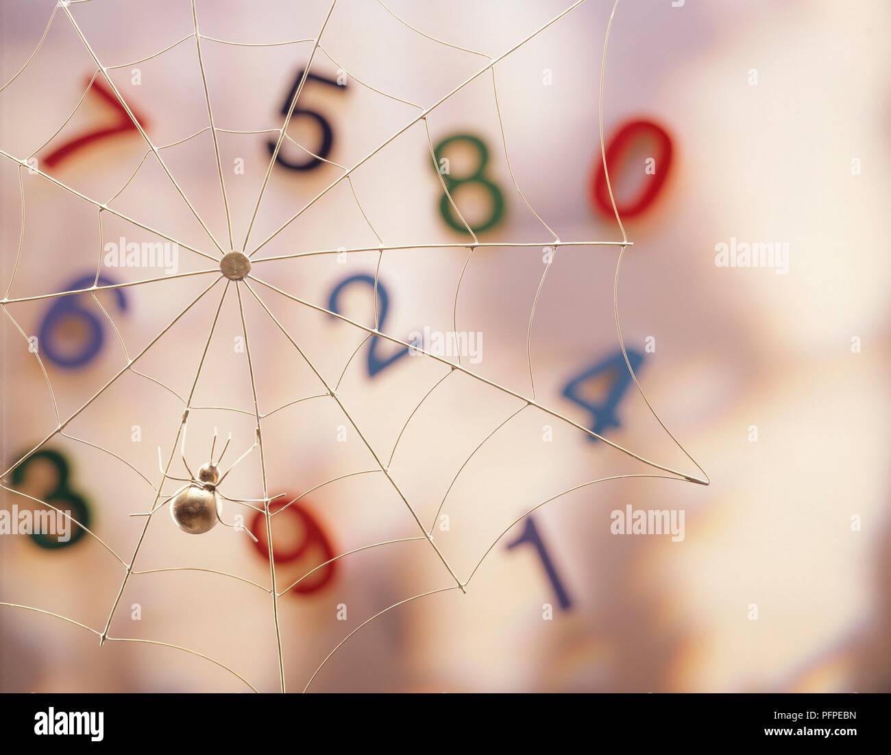Spider on web with numbers in background Stock Photo - Alamy