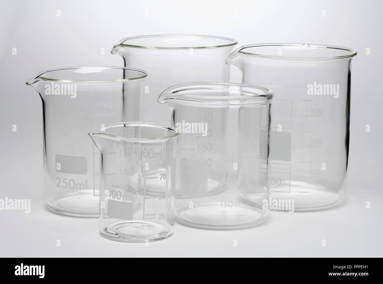 Five empty glass beakers Stock Photo - Alamy