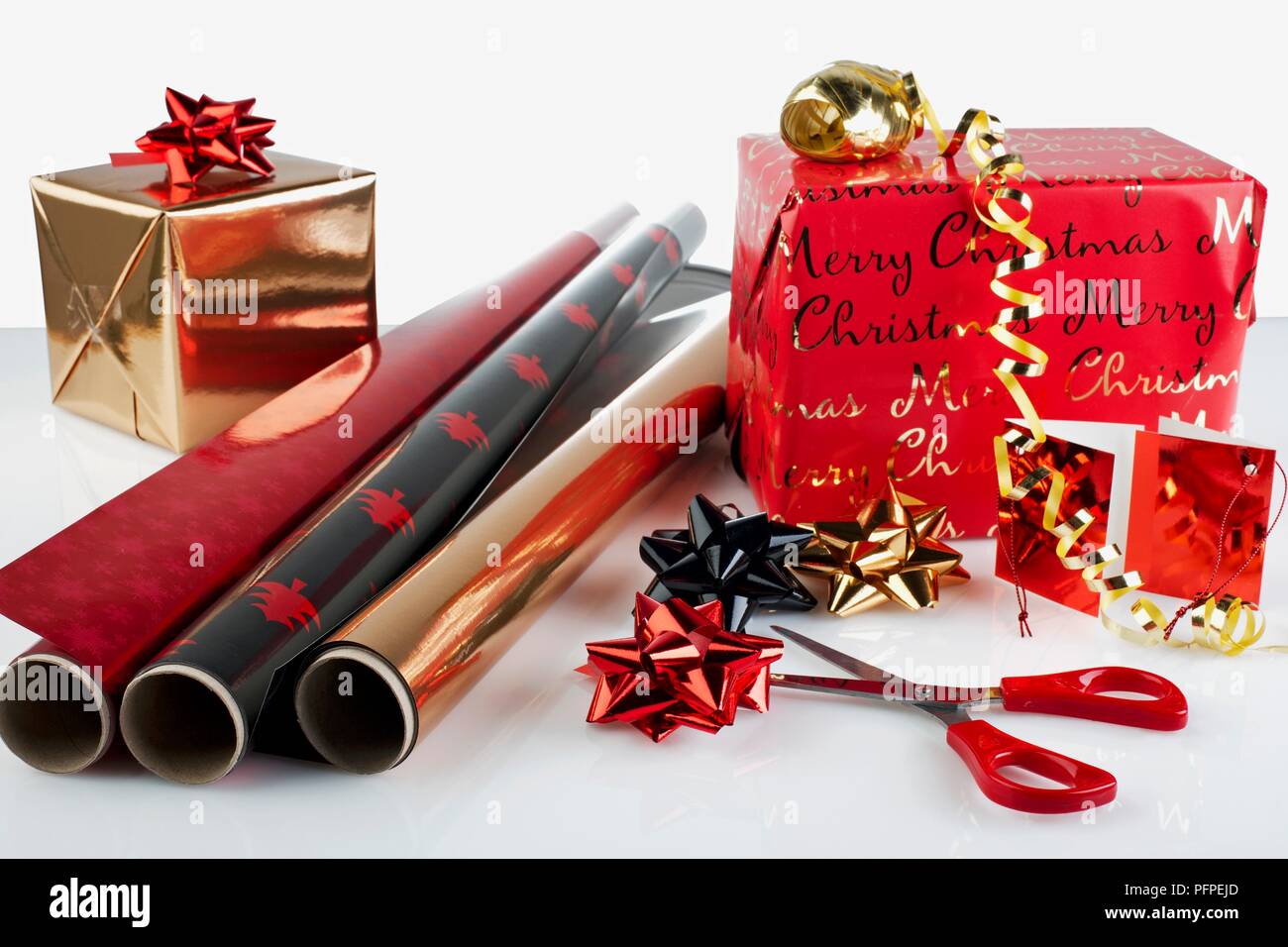 Cristmas gifts, wrapping paper, bows, gift tags and scissors Stock ...