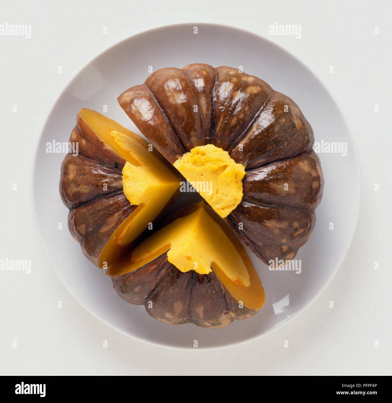 Coconut custard (sangkhaya) in sliced pumpkin in white bowl Stock Photo ...