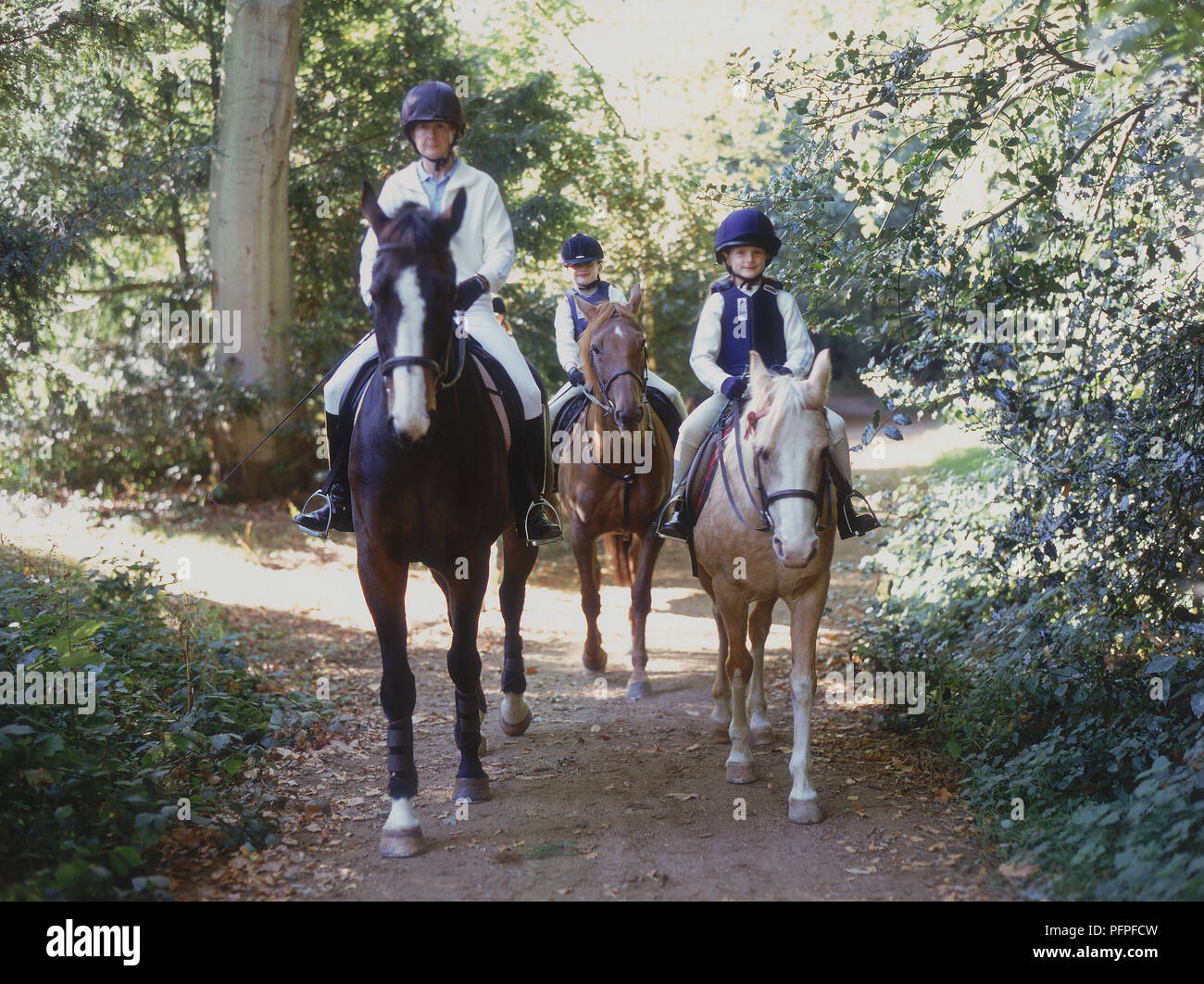 Two girls on ponies riding hi-res stock photography and images - Alamy