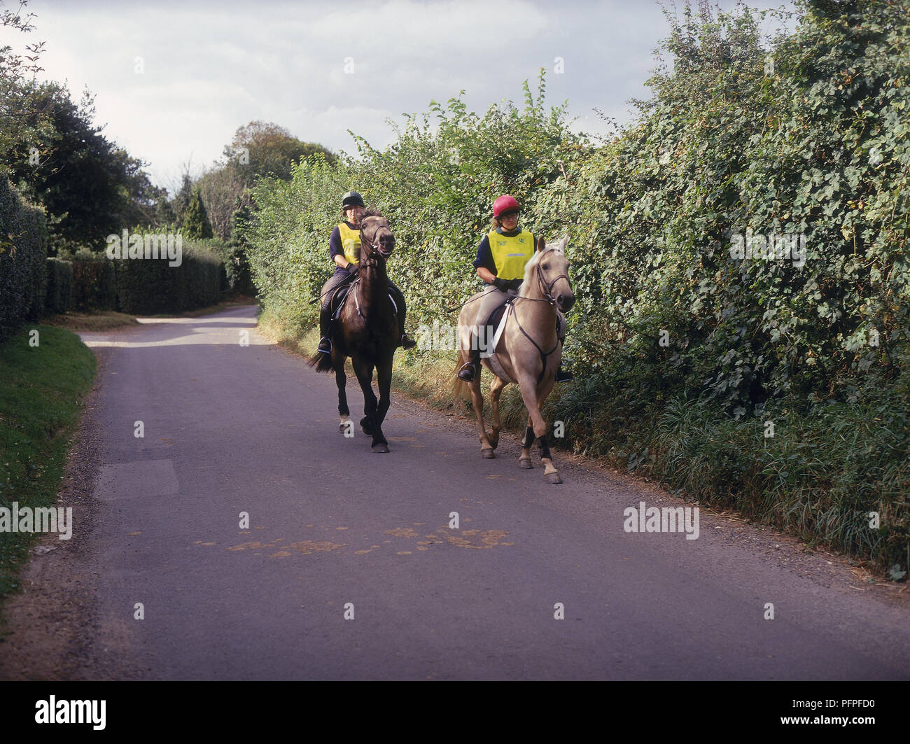 Two young women riding ponies hi-res stock photography and images - Alamy
