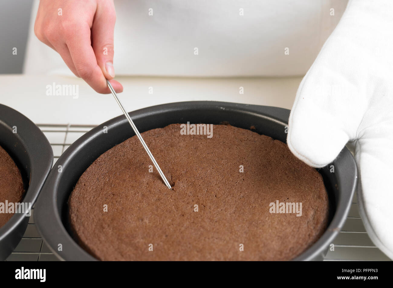 Testing a cake Stock Photo - Alamy