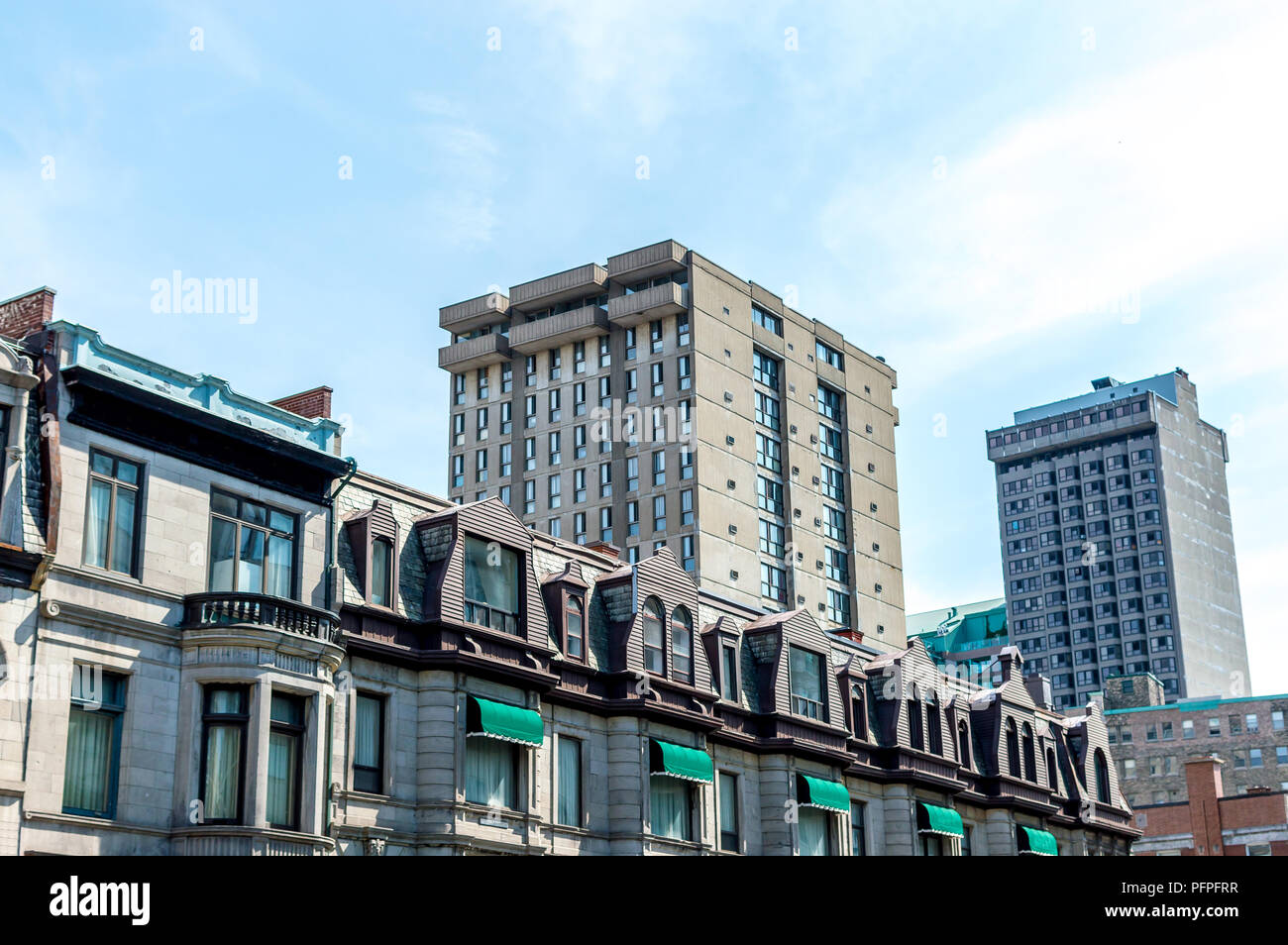 An old historical building with the large windows in Montreal downtown ...