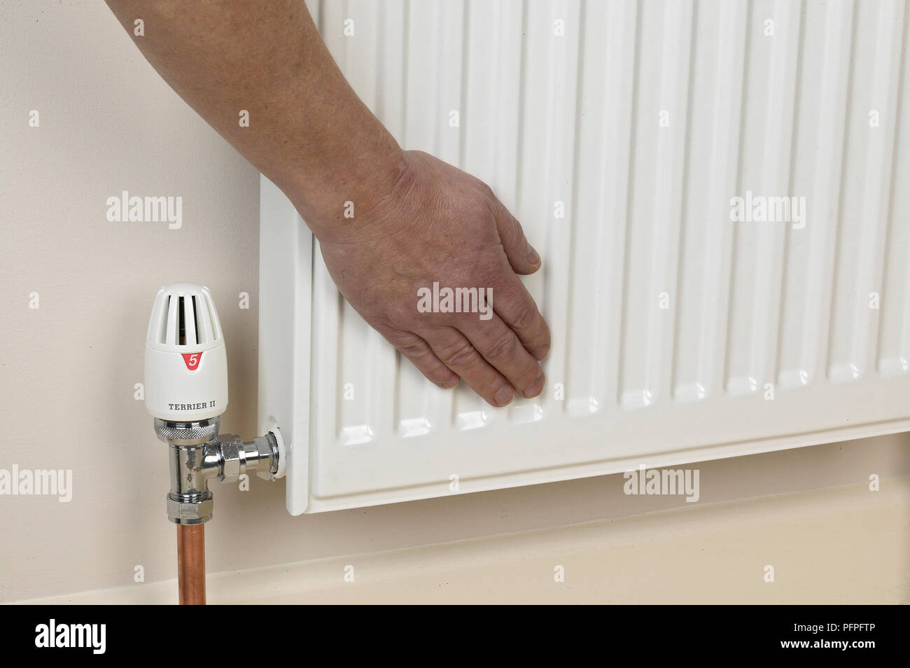 Checking temperature of radiator Stock Photo - Alamy