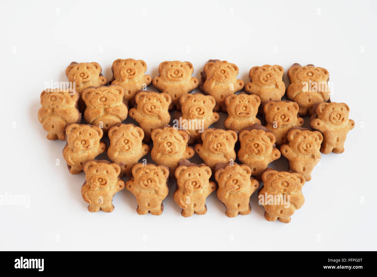 Teddy shaped biscuits arranged in rows Stock Photo - Alamy