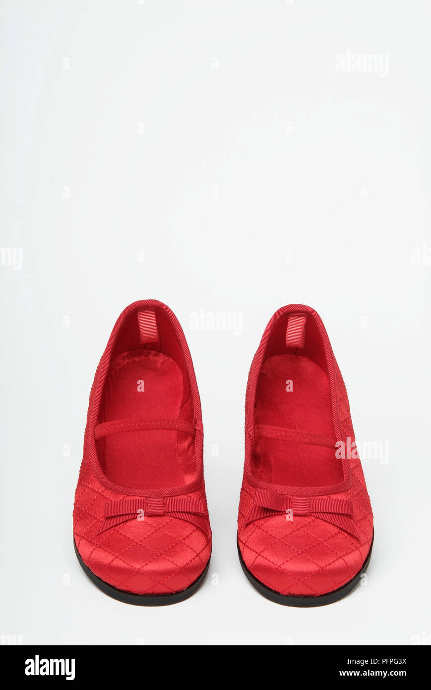 Pair of red fabric shoes Stock Photo - Alamy