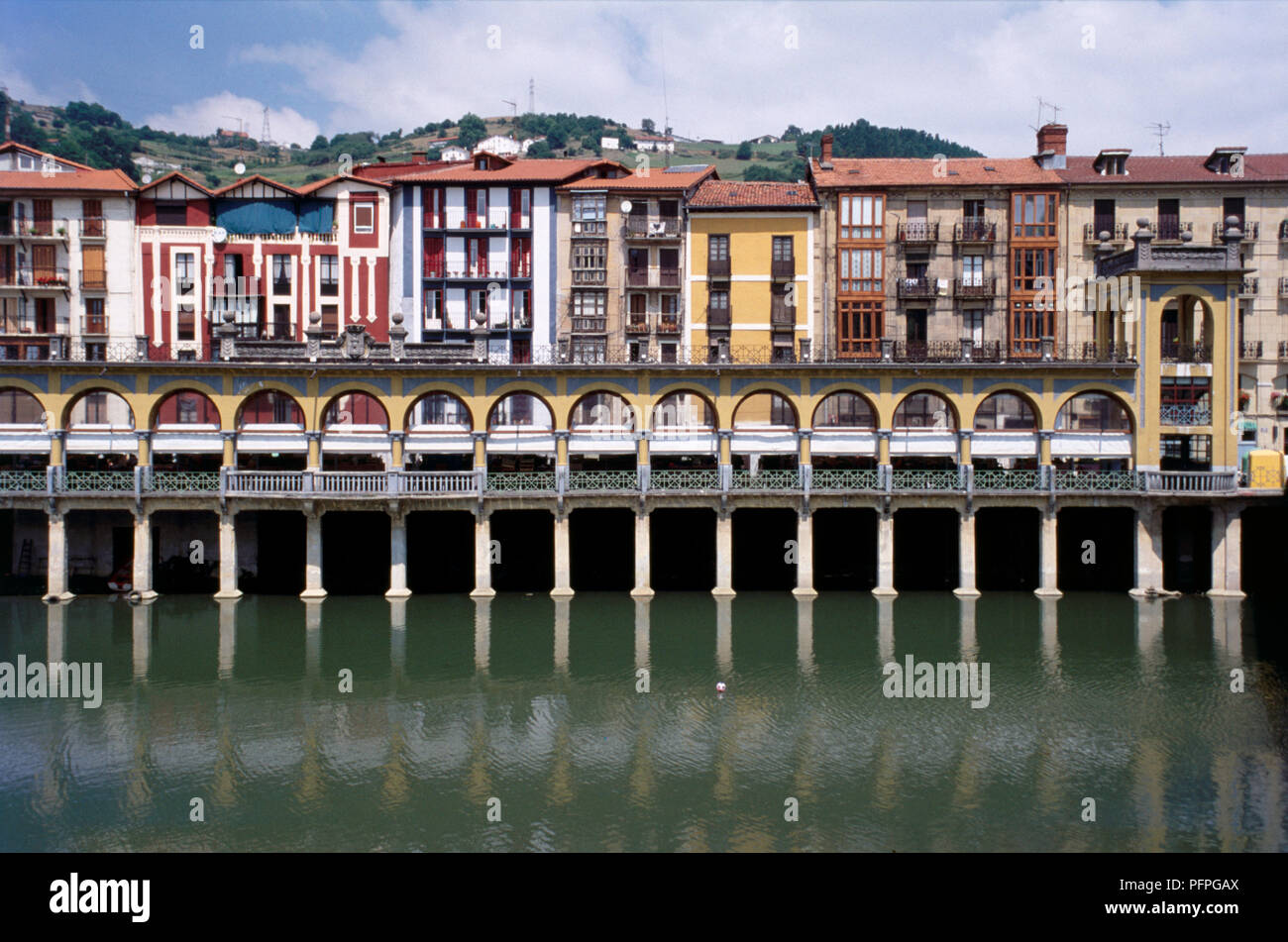 Spain, Northern Spain, Basque Country, Tolosa, arcaded pier along river ...