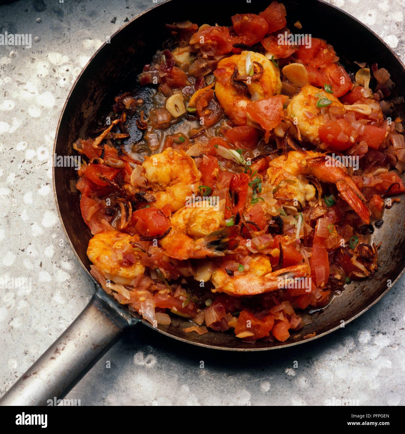 Udang asam pedas, Indonesian prawn curry in a frying pan Stock Photo ...