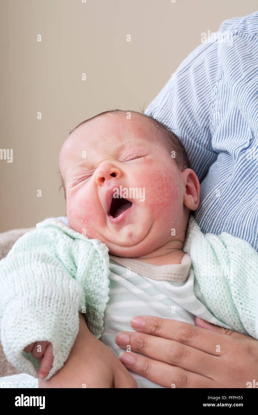 Cradled hi-res stock photography and images - Alamy