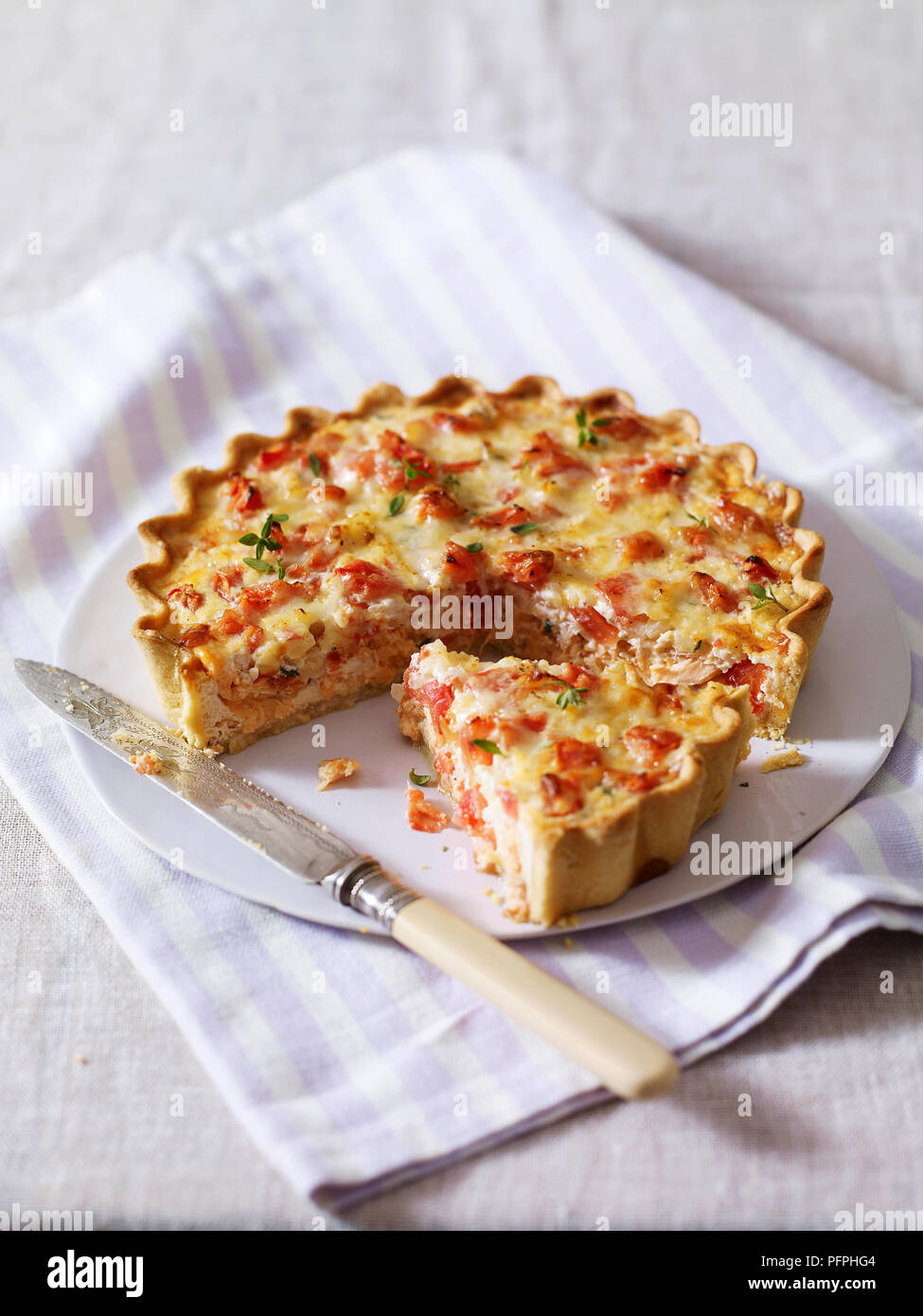 Tarte au poissons served on plate with knife Stock Photo - Alamy