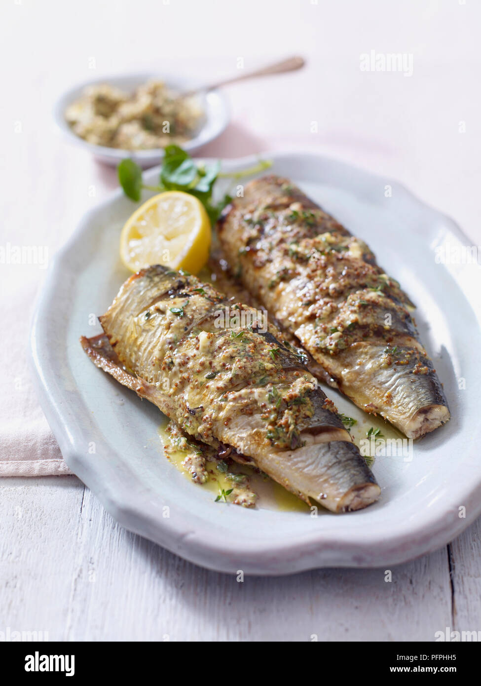 Grilled herring with mustard butter Stock Photo - Alamy