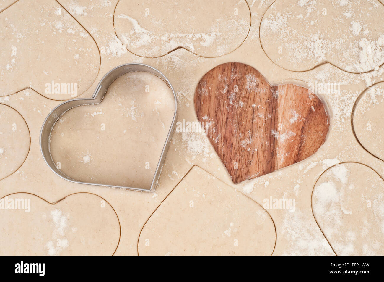 Cutting out heart shapes with a cookie cutter Stock Photo - Alamy
