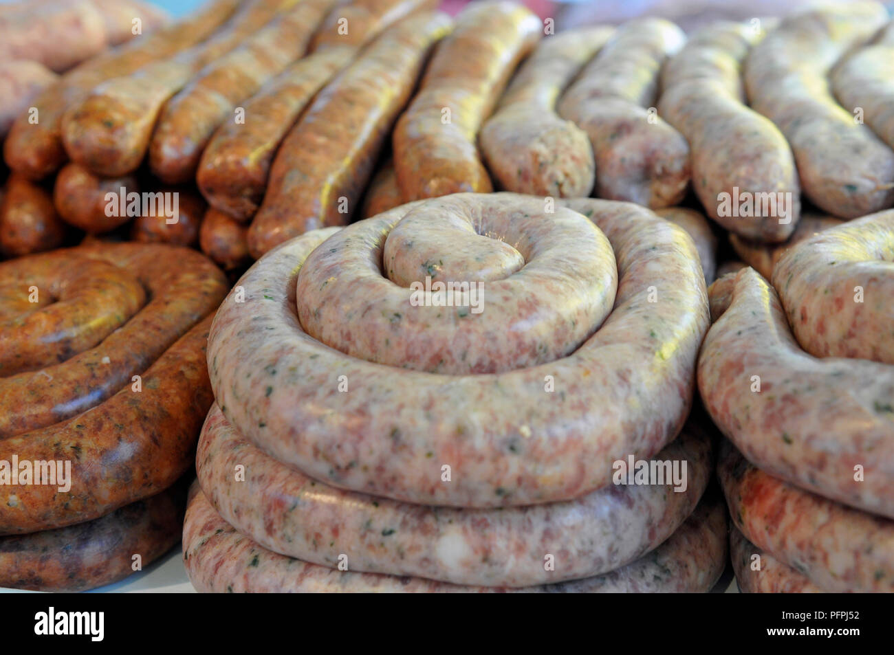 Raw sausages on market stall, close-up Stock Photo - Alamy