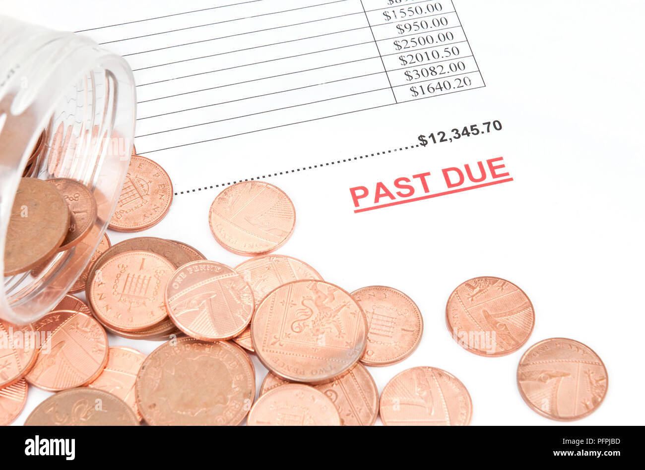 List of overdue payments and coins spilling out of jar Stock Photo - Alamy