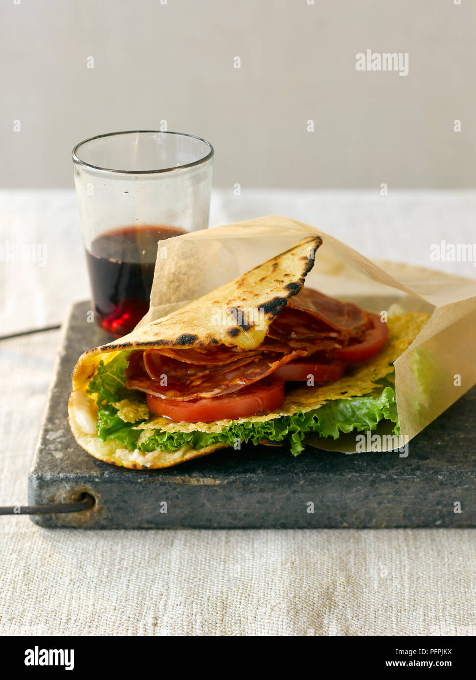 Piadina stuffed with soppressata salami, tomatoes, romaine lettuce and ...