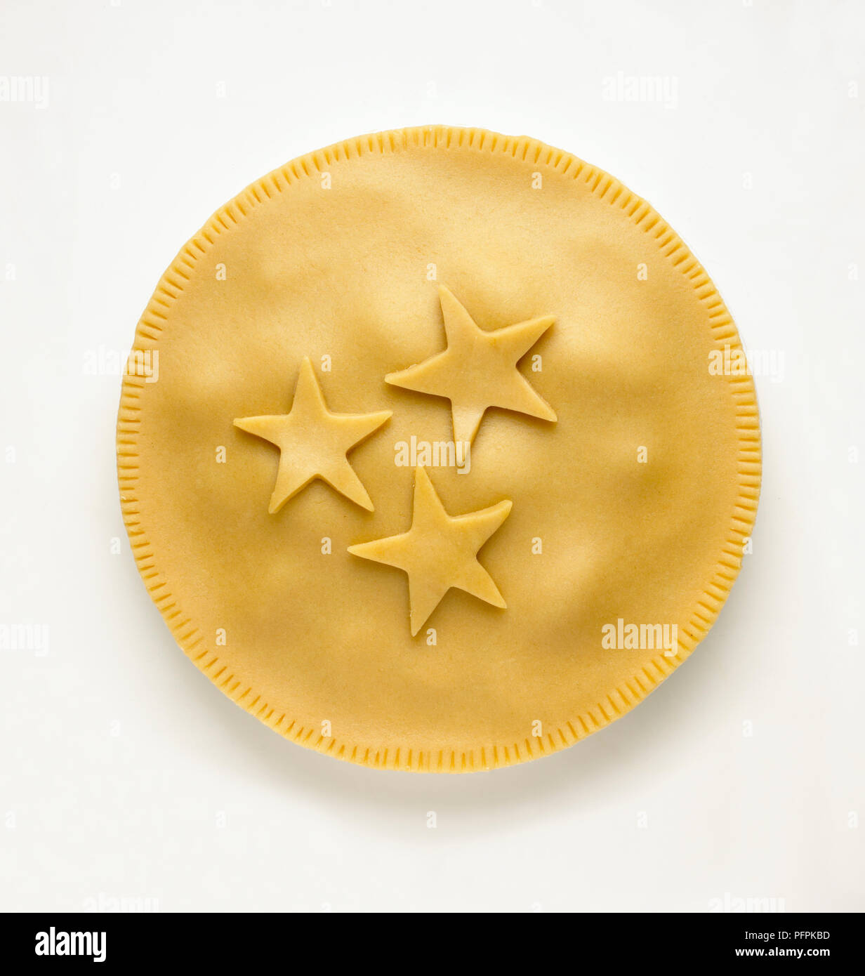 Pie with fork-crimped edge and decorated with pastry stars Stock Photo ...