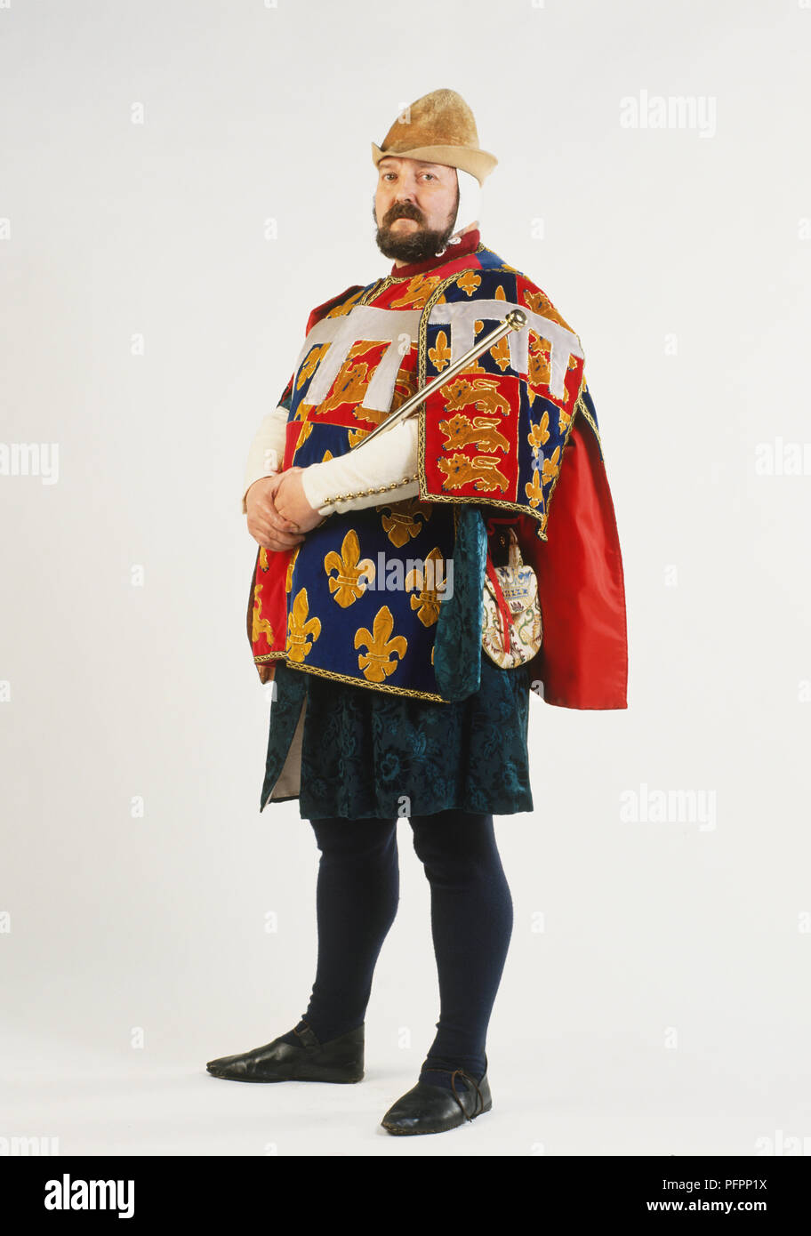 Bearded medieval courtier in colourful costume Stock Photo - Alamy