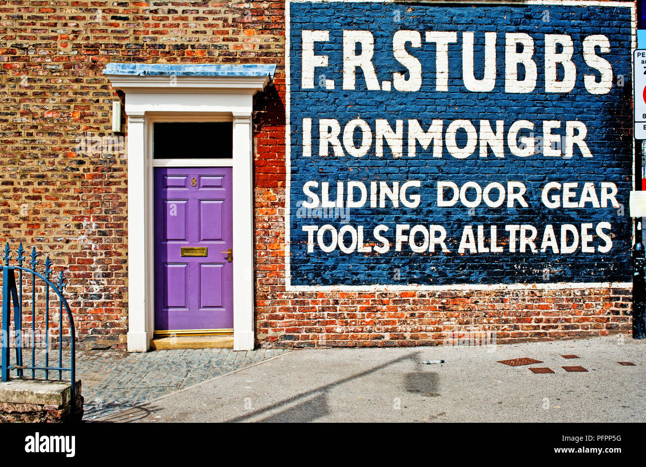 Ironmonger painted sign on wall, Merchantgate, York, England Stock ...