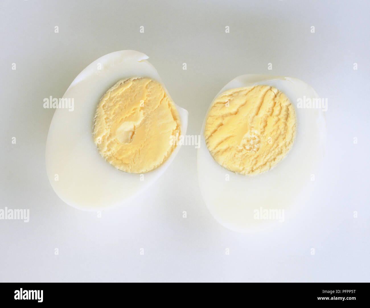 Halved cooked egg Stock Photo - Alamy