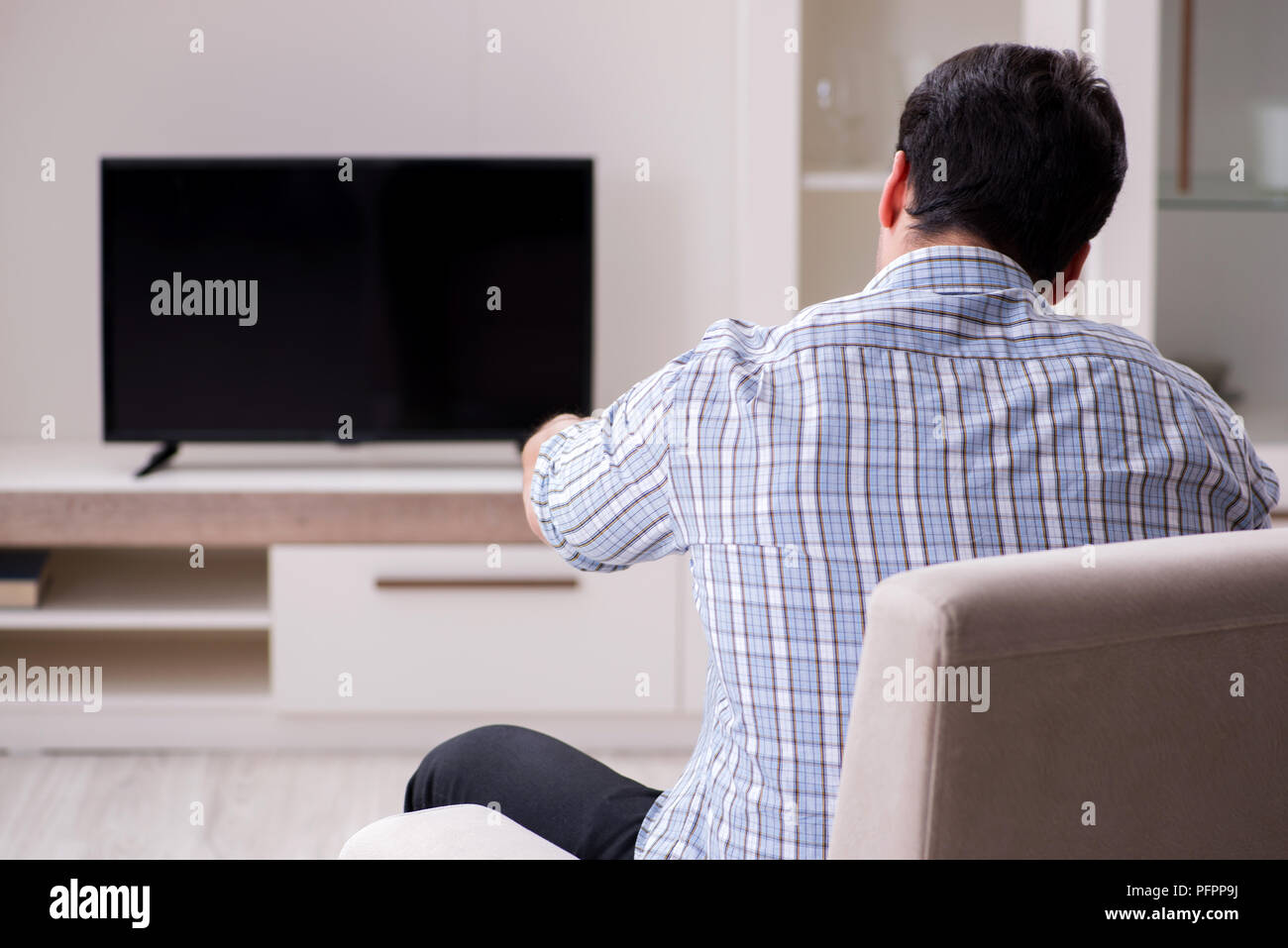 Back view young man switching hi-res stock photography and images - Alamy