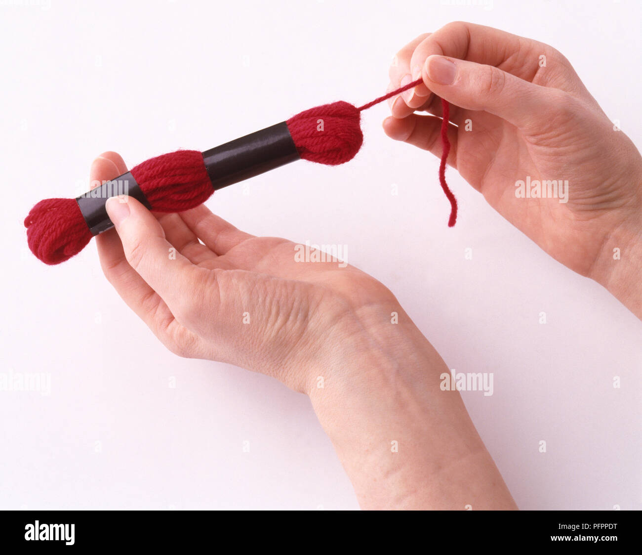 Pulling thread hi-res stock photography and images - Alamy