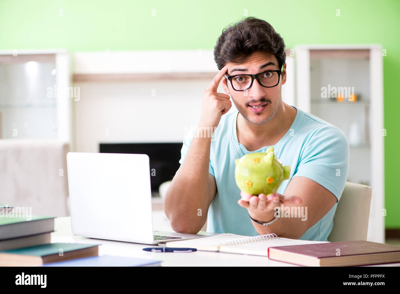 Student preparing for university exams at home Stock Photo - Alamy