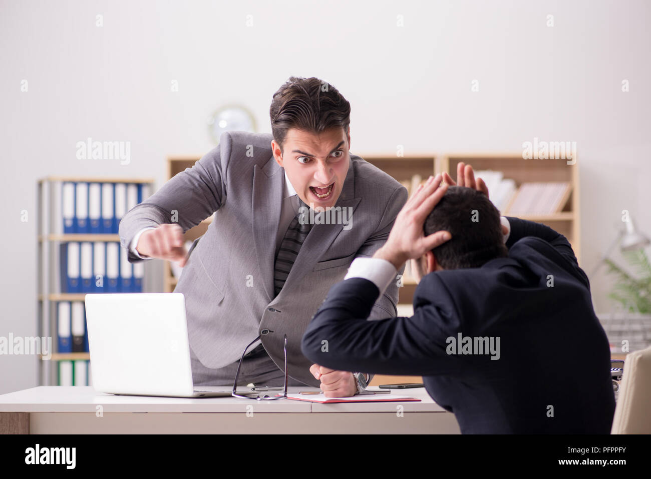 Angry boss shouting at his employee Stock Photo - Alamy