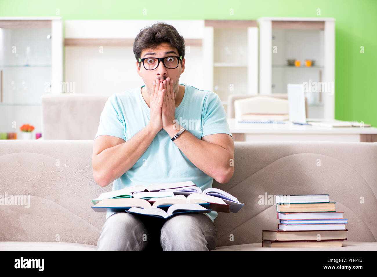 Student preparing for university exams at home Stock Photo - Alamy