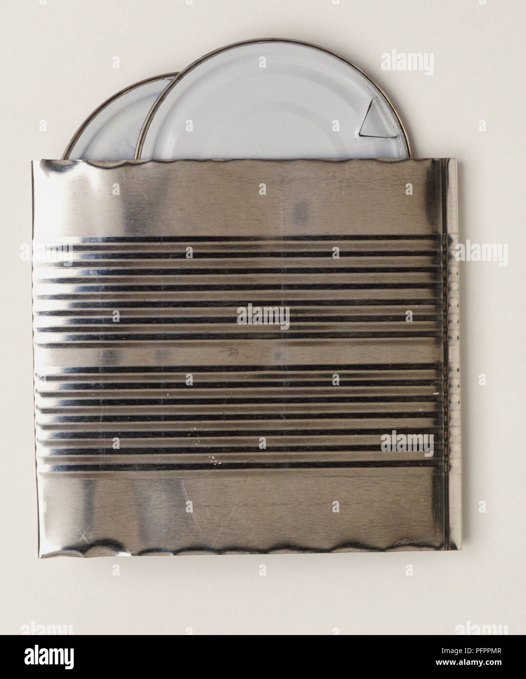 Flattened tin can Stock Photo - Alamy