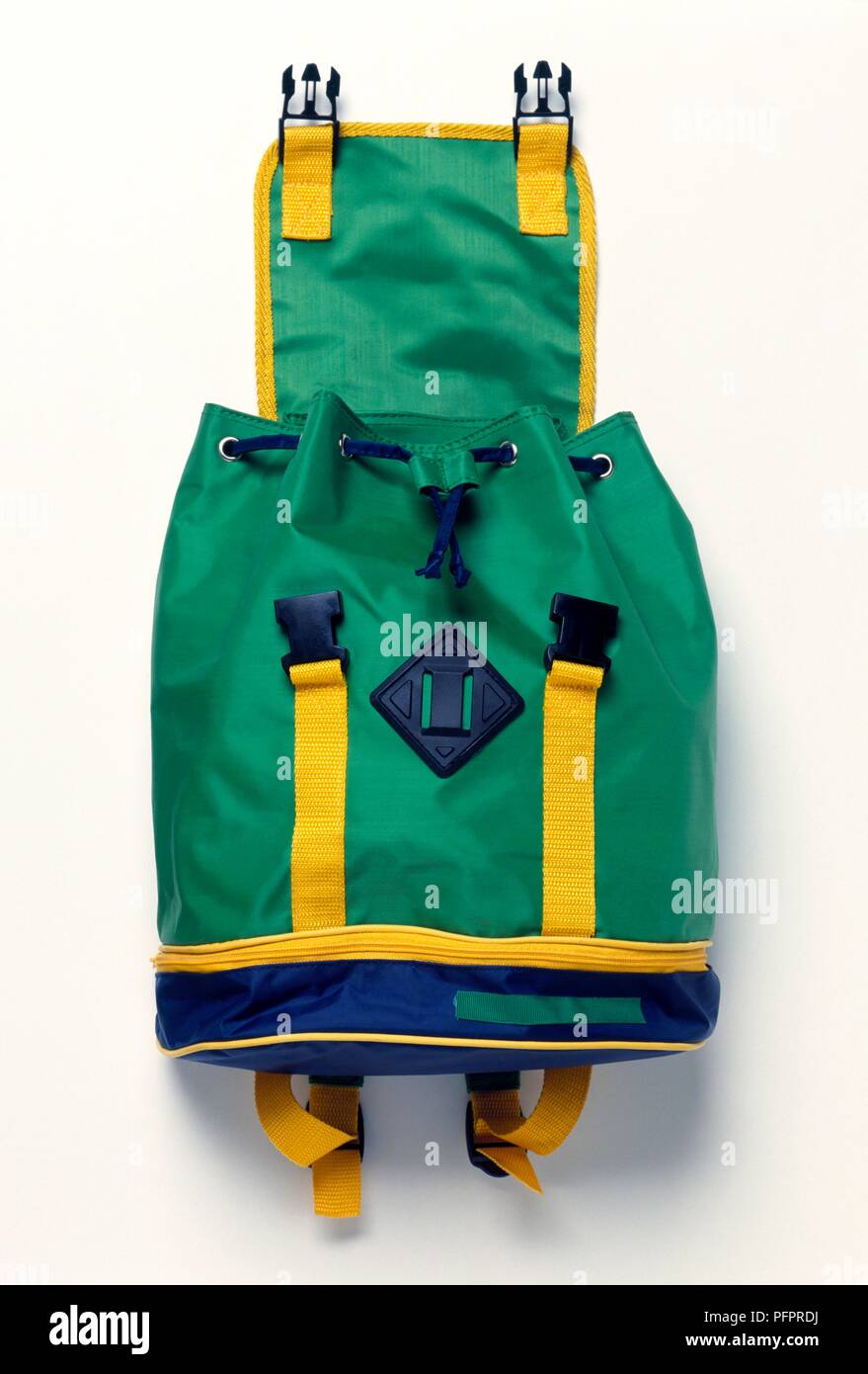 Green and yellow rucksack with flap open, close-up Stock Photo - Alamy