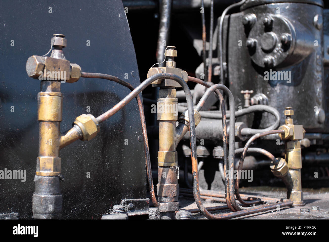 Details of a vintage steam train, seeing bronze pieces Stock Photo - Alamy