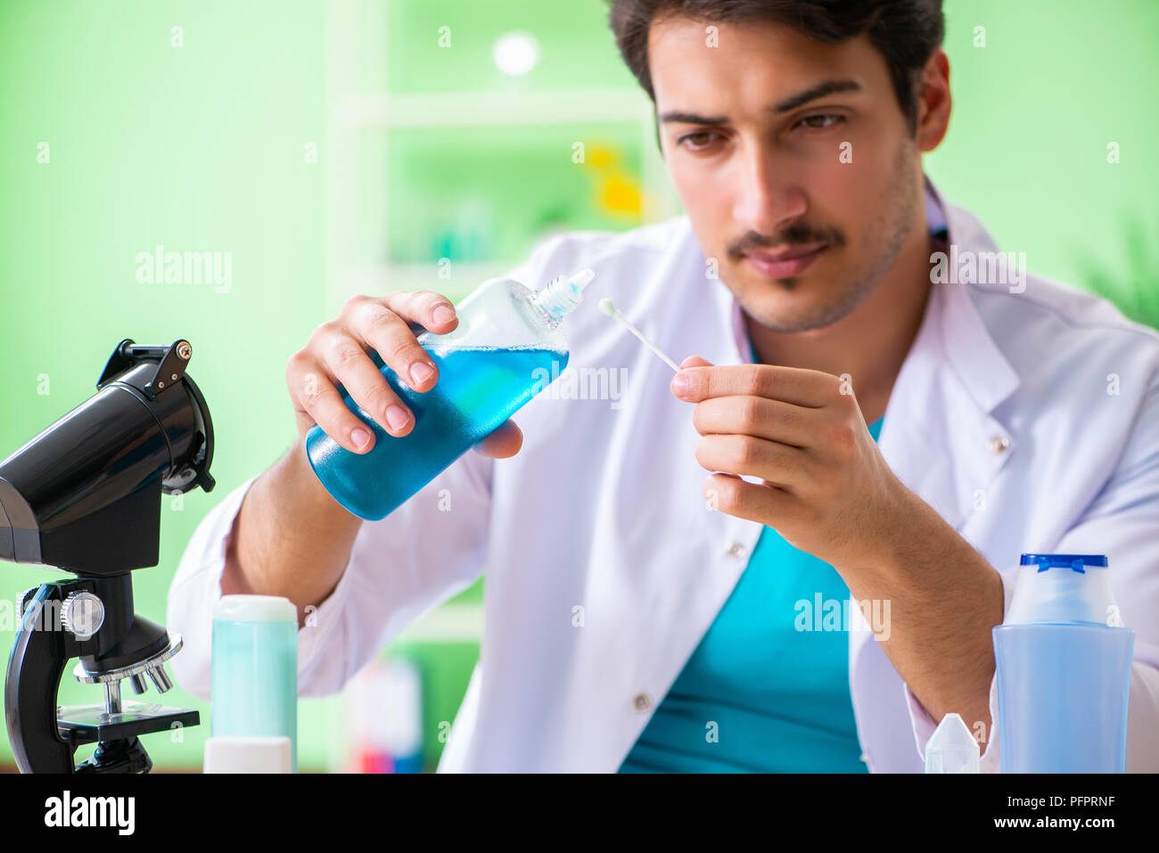 Chemist testing soap in the lab Stock Photo - Alamy