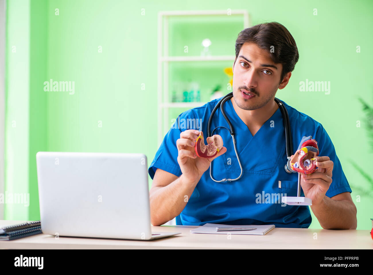 Doctor student explaining heart problems Stock Photo - Alamy
