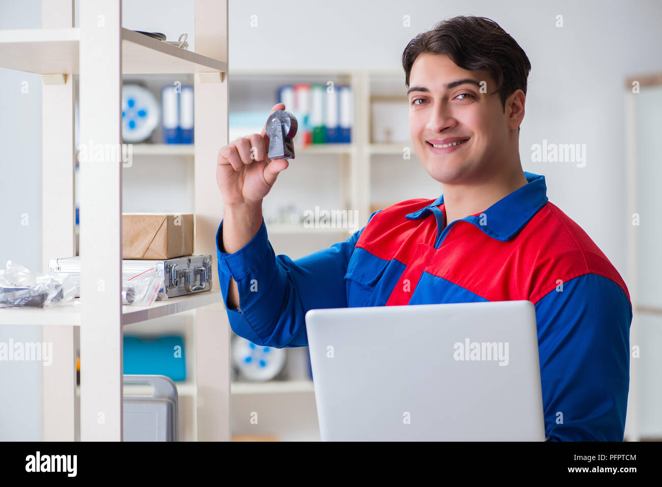 Man working in the postal warehouse Stock Photo - Alamy