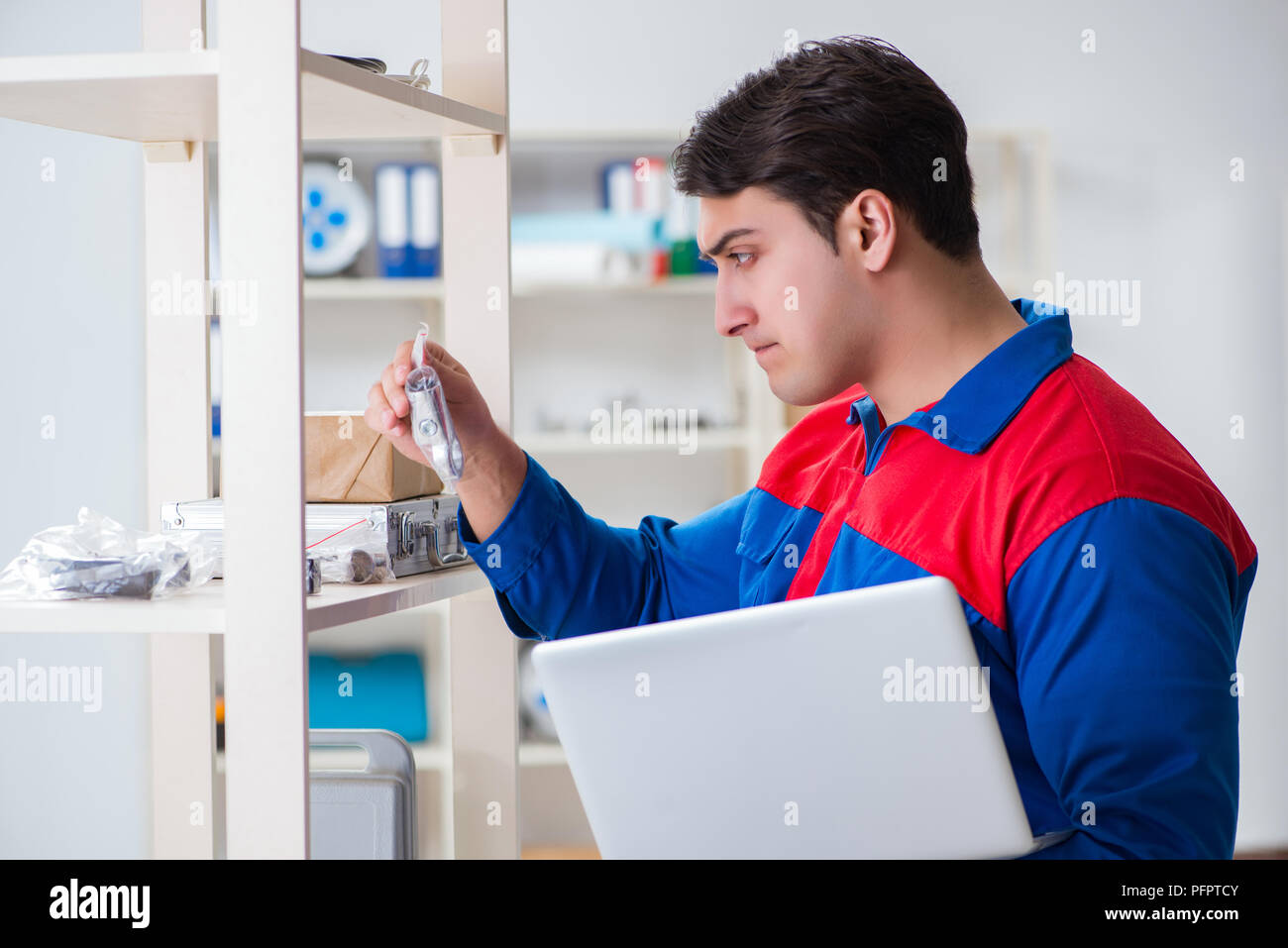 Man working in the postal warehouse Stock Photo - Alamy