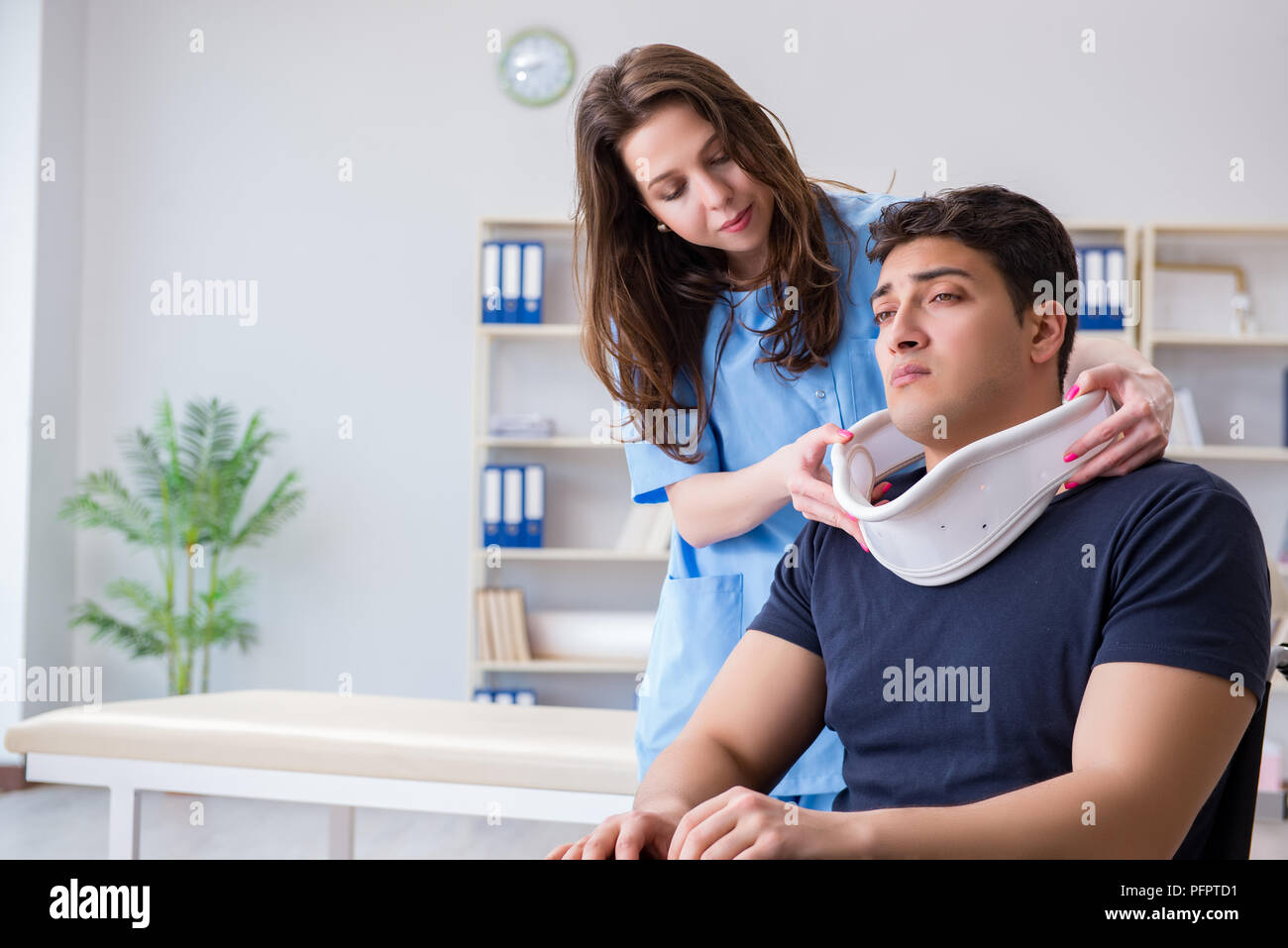 Man with neck injury visiting doctor for check-up Stock Photo - Alamy